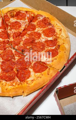 Carton box with delicious pizza on wooden background Stock Photo - Alamy