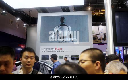 Visitors view a Tesla humanoid robot at the World Artificial ...