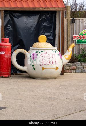 Very large teapot with arrow pointing the way to tearooms Stock Photo ...