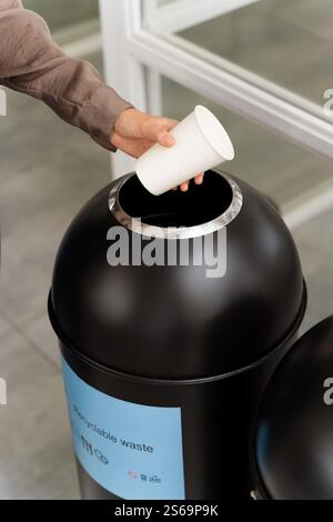 Woman choosing a proper container for throwing paper cup Stock Photo ...