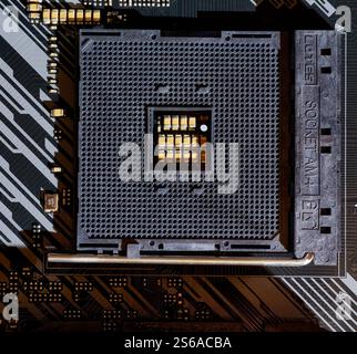 A close-up view of an AM4 CPU socket on a motherboard. This detailed ...