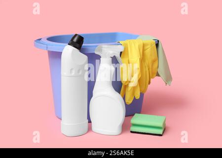 Bottles of mold remover and sponge on yellow background Stock Photo - Alamy