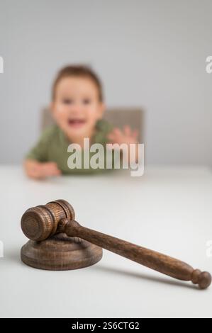 Little boy behind judge's gavel Stock Photo - Alamy