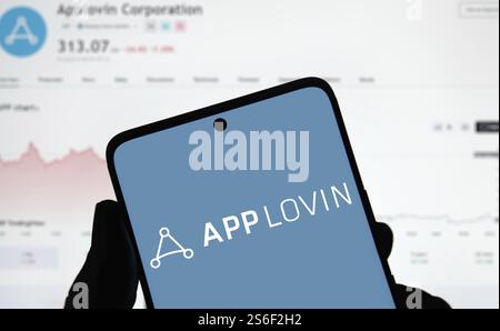 App lovin logo is displayed on smartphone. AppLovin Corporation is an ...