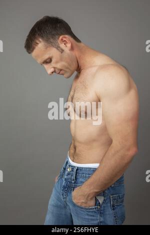 An image of a handsome muscle man side view Stock Photo - Alamy