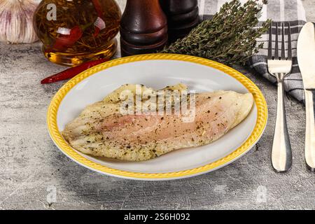 Baked tilapia fish fillet with spices Stock Photo - Alamy