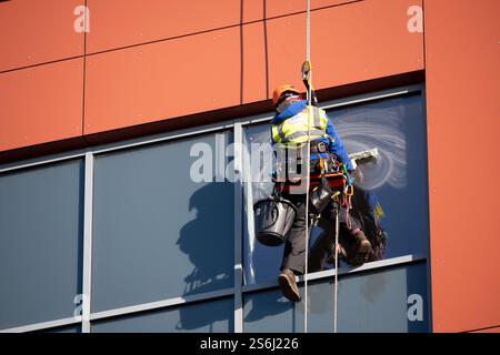 Window cleaner on Hilton Garden Inn hotel, Birmingham Airport, UK Stock ...