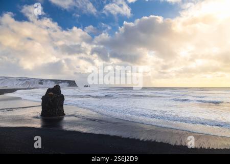 View of at sunset in winter at Reynisfjara beach with Arnardrangur ...