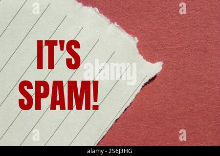 It's spam message written on ripped torn paper piece with stone ...