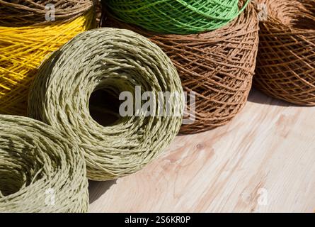 Raffia balls close-up. Skeins of multi-colored raffia are ready for ...
