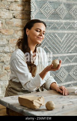 woman enjoys shaping clay in pottery class, connecting through art ...