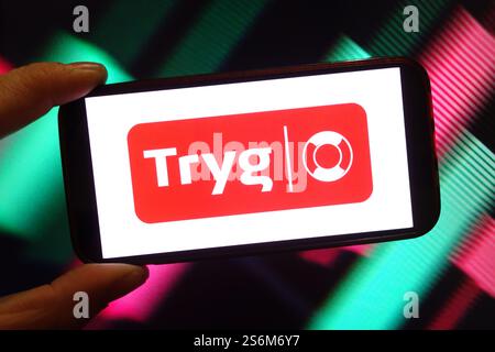 In this photo illustration, the Tryg company logo is seen displayed on ...