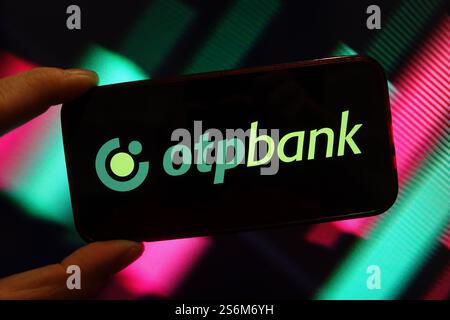In this photo illustration, the OTP Bank company logo is seen displayed ...