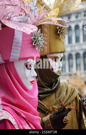 Noble couple masks in costumes decorated with flowers, butterflies and ...