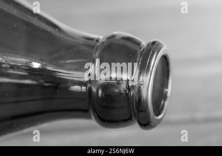 Bottle of beer and empty glass lie on the ears of rye. Concept of ...