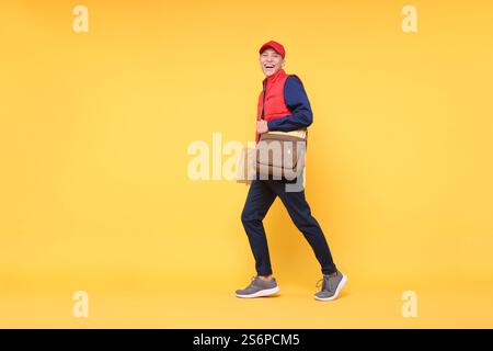 Happy postman with bag and envelopes on light blue background. Space ...