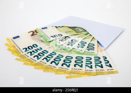Envelope with euro bills, symbolic image, black money, white background ...