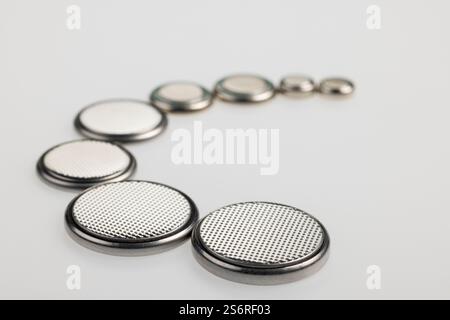 New button cells, various sizes, white background Stock Photo - Alamy