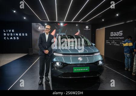 Rajeev Chaba, CEO Emeritus, MG Motor India poses with MG Windsor ev car ...