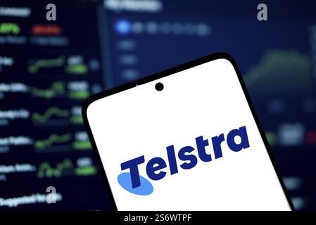 Telstra logo is displayed on smartphone. Telstra Group Limited is an ...