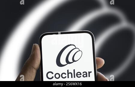 Cochlear logo is displayed on smartphone. Cochlear is a leading medical ...
