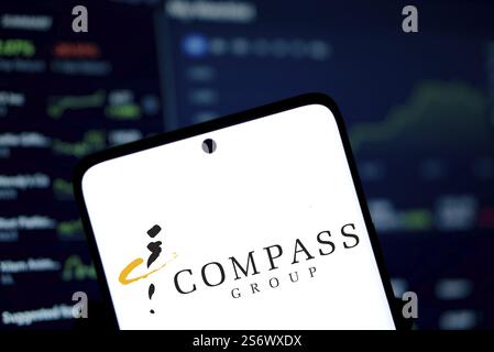 Compass Group logo is displayed on smartphone Stock Photo - Alamy