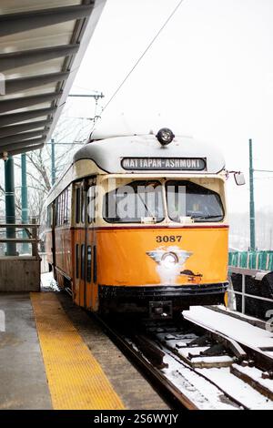 The Mattapan trolley arrives in the snow at Ashmont station in Boston ...