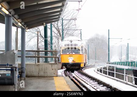 The Mattapan trolley arrives in the snow at Ashmont station in Boston ...