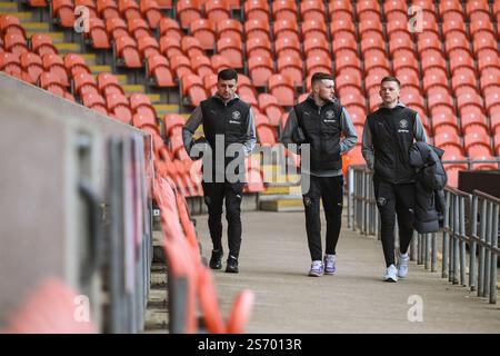 Albie Morgan, Sonny Carey and Andy Lyons of Blackpool arrive ahead of ...