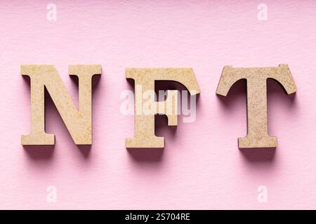 NFT inscription on pink background. Non-fungible token composed of ...