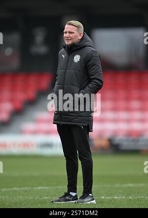 Fleetwood Town's head coach Pete Wild inspects the pitch ahead of the ...