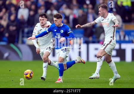 Cardiff City's Cian Ashford (left) and Leeds United's Junior Firpo ...