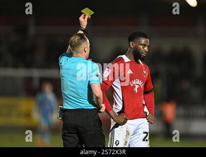 Salford City's Kylian Kouassi receives a red card from referee David ...