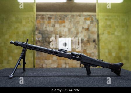 German machine gun on bipod is aimed towards the target at a shooting ...