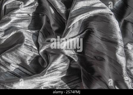 Reflective silver material with soft creases and folds Stock Photo - Alamy