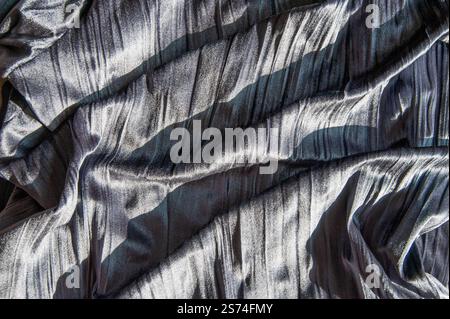 Reflective silver material with soft creases and folds Stock Photo - Alamy