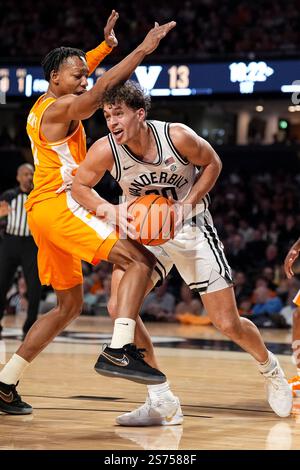 Vanderbilt guard Chris Manon (30) shoots the ball over Kentucky forward ...