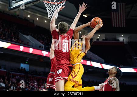 Wisconsin forward Nolan Winter (31) shoots over Minnesota forward ...