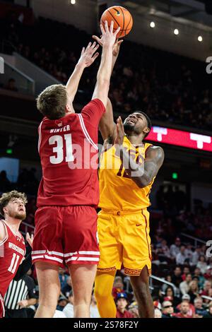 Wisconsin forward Nolan Winter, center left, dunks against Iowa forward ...