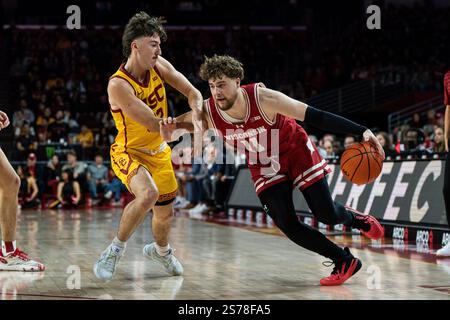 Wisconsin guard Max Klesmit drives up court during the first half of an ...