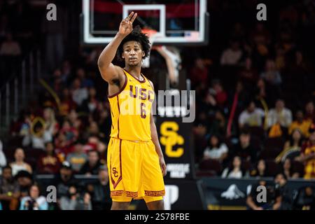Southern California guard Wesley Yates III, right, shoots as Michigan ...