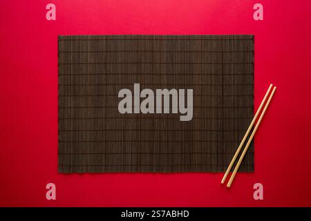 Empty plate with wooden sticks for Asian food on a dark concrete ...