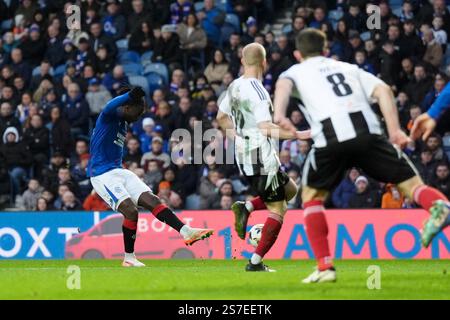 Rangers' Clinton Nsiala (left) scores his sides second goal during the ...