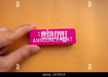 Important announcement message written on ripped torn paper piece with ...