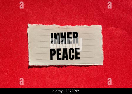 Inner peace message written on ripped torn paper piece with a pink ...