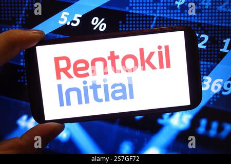 In this photo illustration, the Rentokil Initial company logo is seen ...
