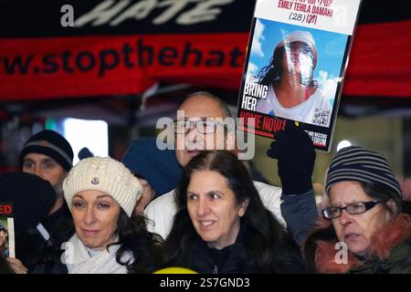 People at a gathering at the Golders Green War Memorial, London, to ...