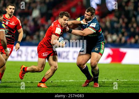 Antoine Dupont (Stade Toulousain) in arms of Guillaume Marchand (Stade ...