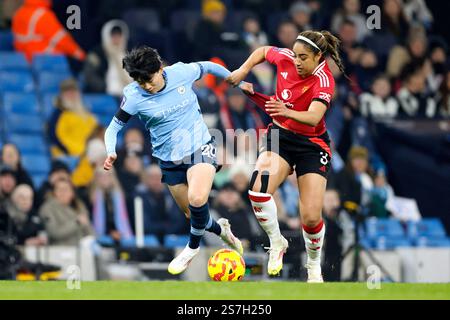 Manchester United's Gabrielle George (left) and Maya Le Tissier warming ...