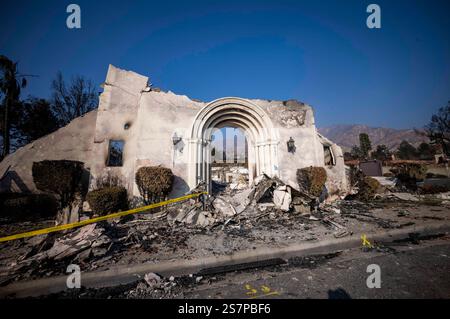 Altadena, California, USA. 19th Jan, 2025. A vehicle and structures ...